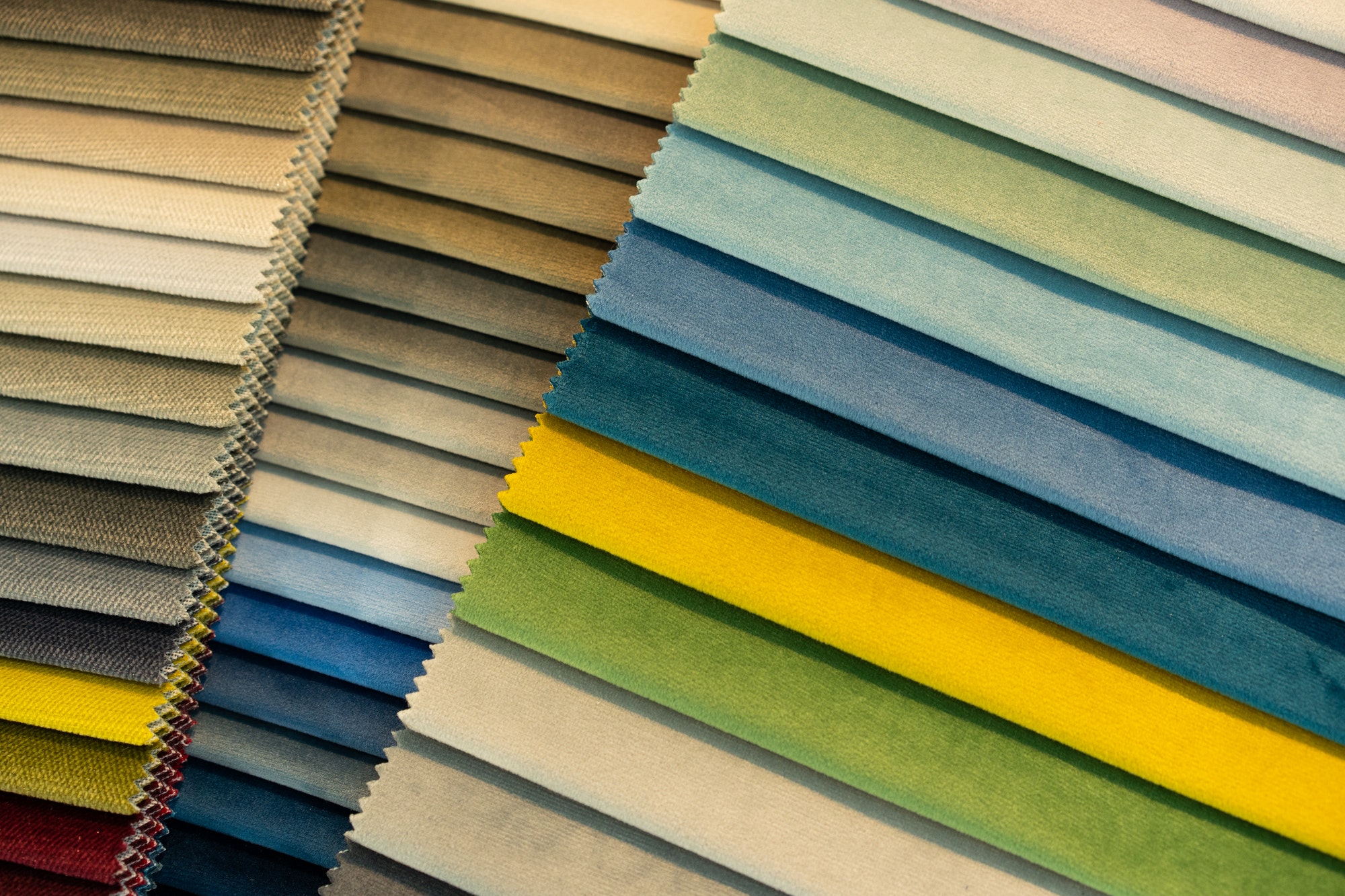 Catalog of multi-colored fabric samples. Textile industry background ...